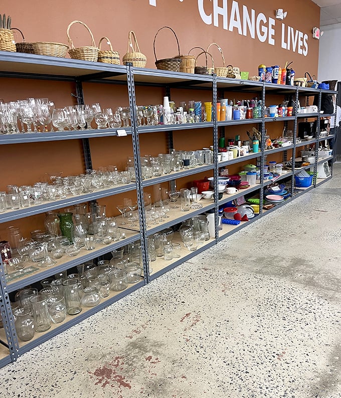 "CHANGE LIVES" isn't just wall decor—it's the mission. Every glass, basket, and mug purchased helps fund community programs that transform Greenville.