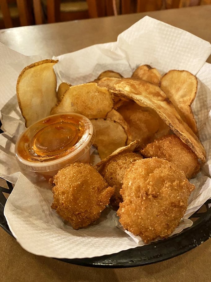 Hush puppies and homemade chips – the supporting actors that deserve their own spin-off show. Crispy, comforting carbs that make every bite of trout even better.
