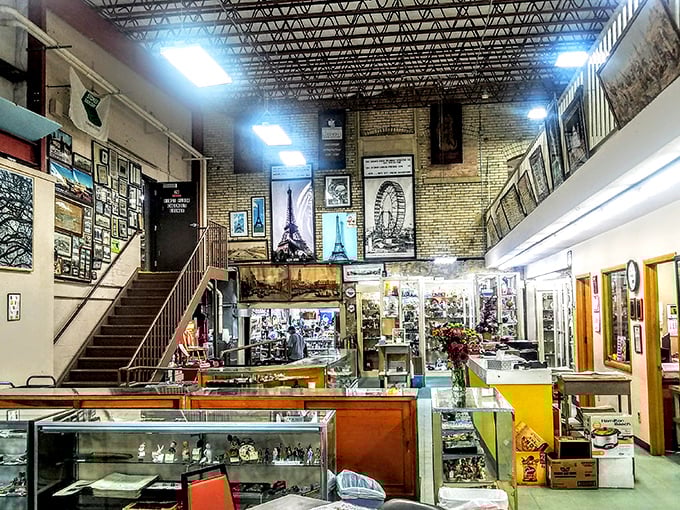 The multi-level wonderland reveals itself with dramatic flair—brick walls and high ceilings framing collections that range from Parisian art to local memorabilia.