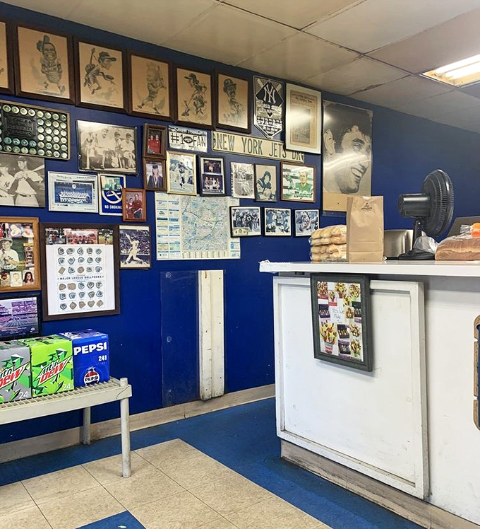 Sports memorabilia covers every inch of wall space—visual proof that great sandwiches and great teams share the same fans.