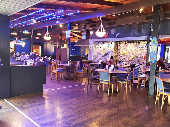 Blue lighting and rustic wood create an underwater grotto vibe—minus the need for scuba gear while you eat.
