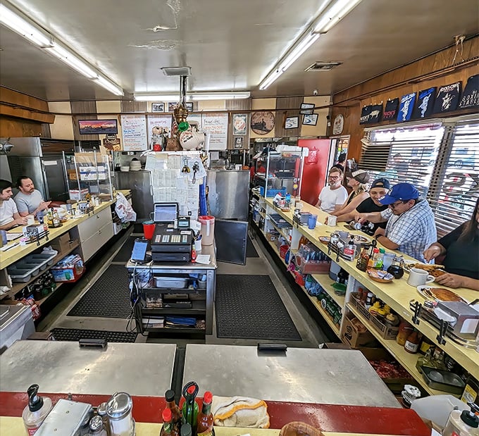 The horseshoe counter isn't just efficient design—it's community architecture where strangers become temporary breakfast companions.