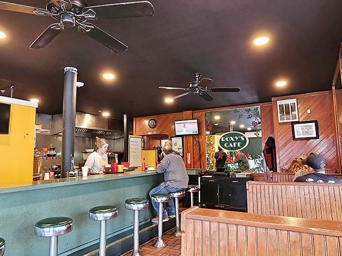 The heart of Roxy's operation – where conversations flow as smoothly as the coffee and everyone gets a front-row seat to the action.