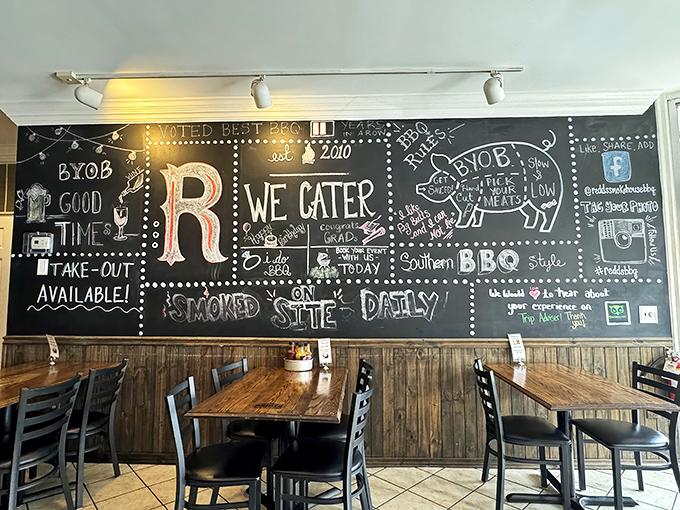 That chalkboard wall isn't just decoration – it's a manifesto of smoke and fire, complete with a pig diagram that's both educational and hunger-inducing.
