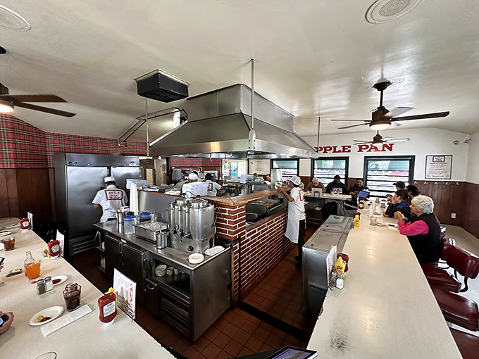 Where burger magic happens. The open kitchen design means you're not just eating the food—you're experiencing its creation.