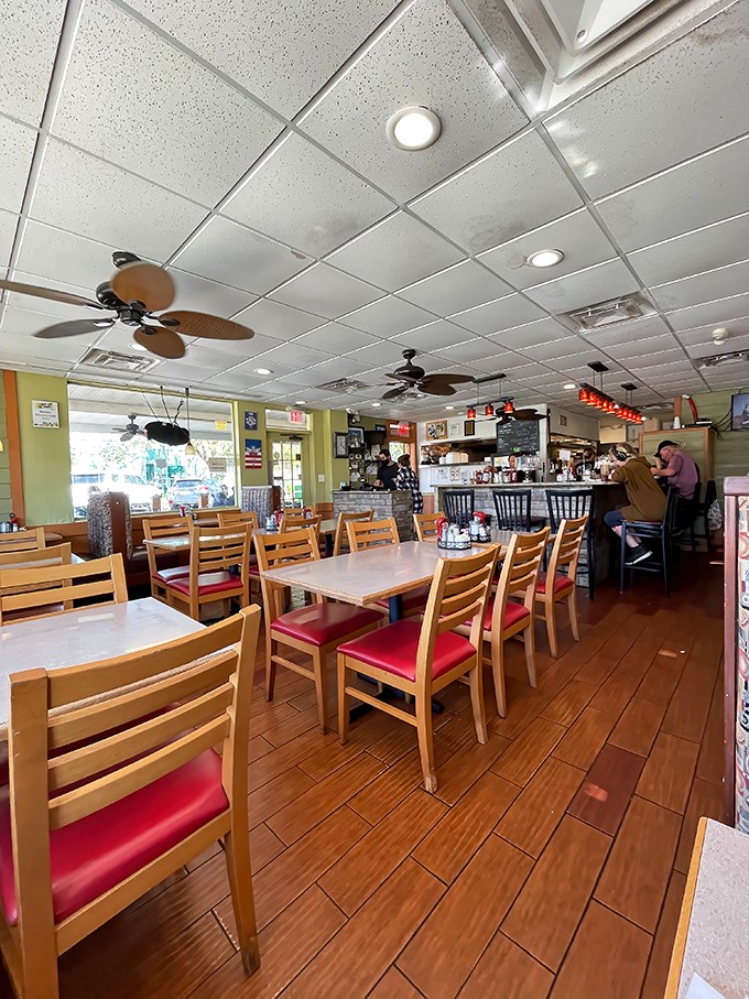 The ceiling fans lazily spin overhead while wooden chairs await the morning rush. This isn't just a restaurant—it's Orlando's living room.