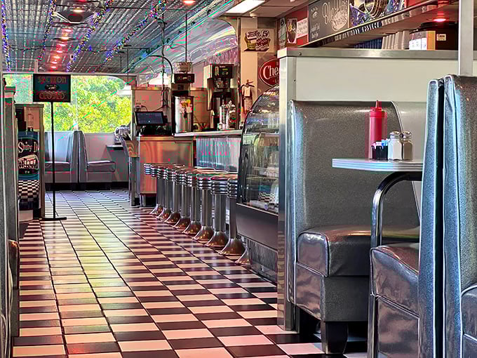 The counter stretches into infinity, each stool an invitation to sit and watch short-order magic happen in real time.
