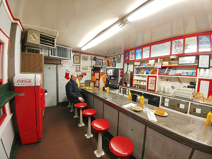 Morning light streams into the narrow diner where a few early birds have secured the best seats in the house—at the counter, where the action happens.