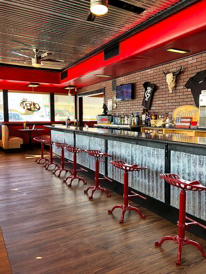 Those red bar stools have heard more barbecue debates than a Kansas City cook-off.