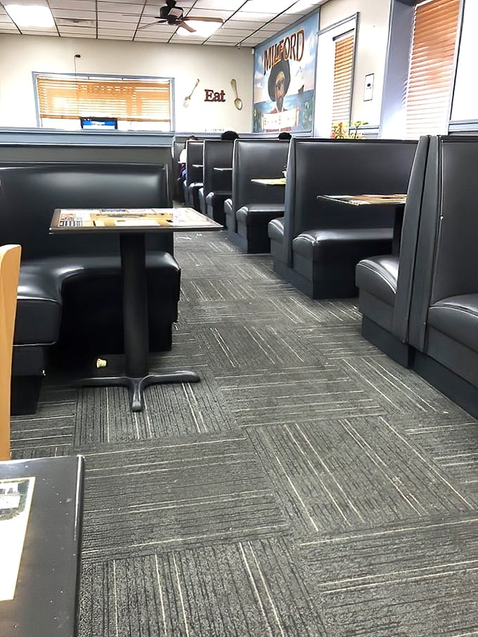 Classic diner booths—where strangers become neighbors and calories don't count. The "Milford" sign reminds you that local pride is always on the menu.