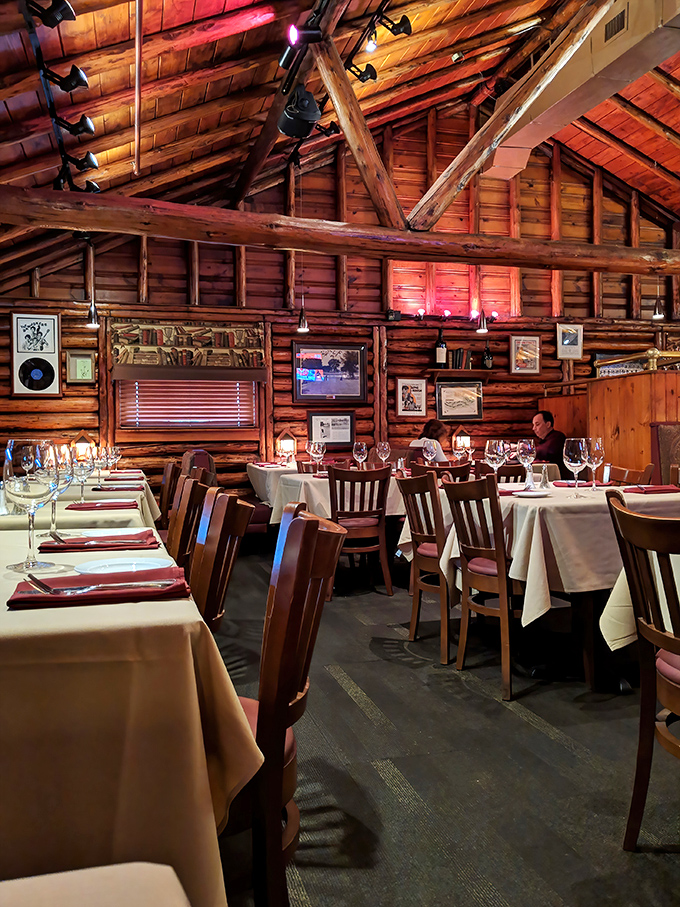 The vaulted wooden ceiling and warm lighting create the sensation of dining inside the world's most delicious Lincoln Log creation.