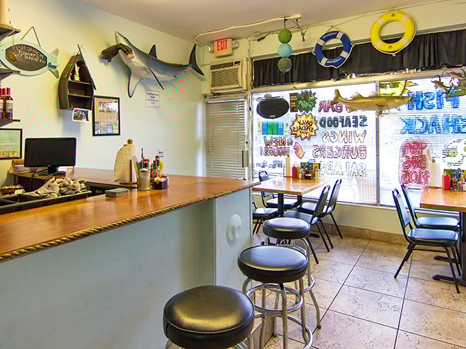 Sharks on the wall, nautical touches everywhere—this isn't décor from a catalog. It's the real deal, collected by people who know their fish.