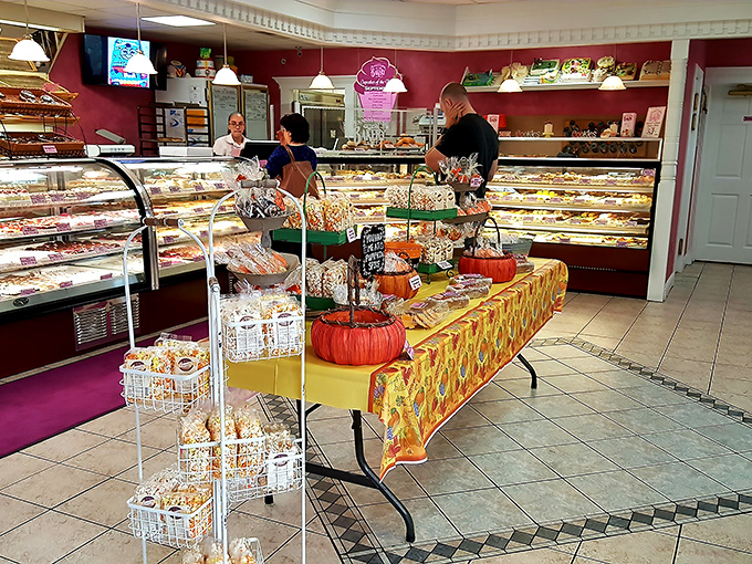 The bakery's fall display transforms seasonal shopping into a festive experience—like Thanksgiving and Halloween had a delicious baby.