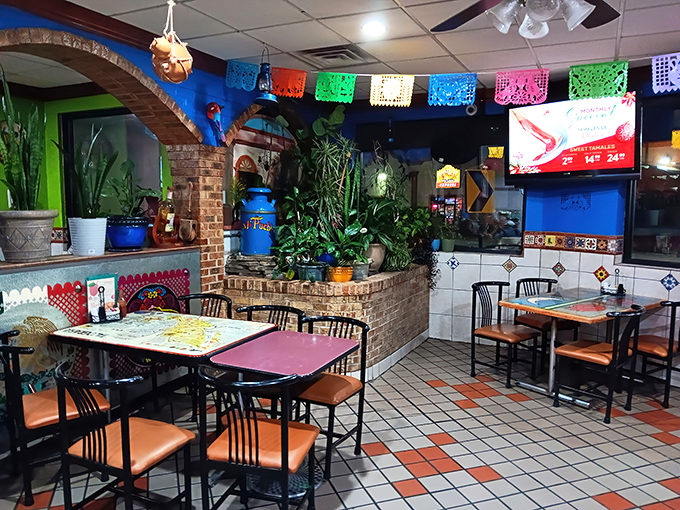 The dining room feels like you've stepped into a Mexican courtyard, complete with brick archways and enough plants to make your home collection look pathetic.