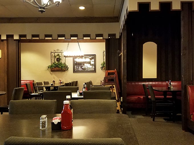 Red vinyl booths and castle-like architectural details create dining spaces that feel both communal and intimate—the perfect backdrop for serious eating.