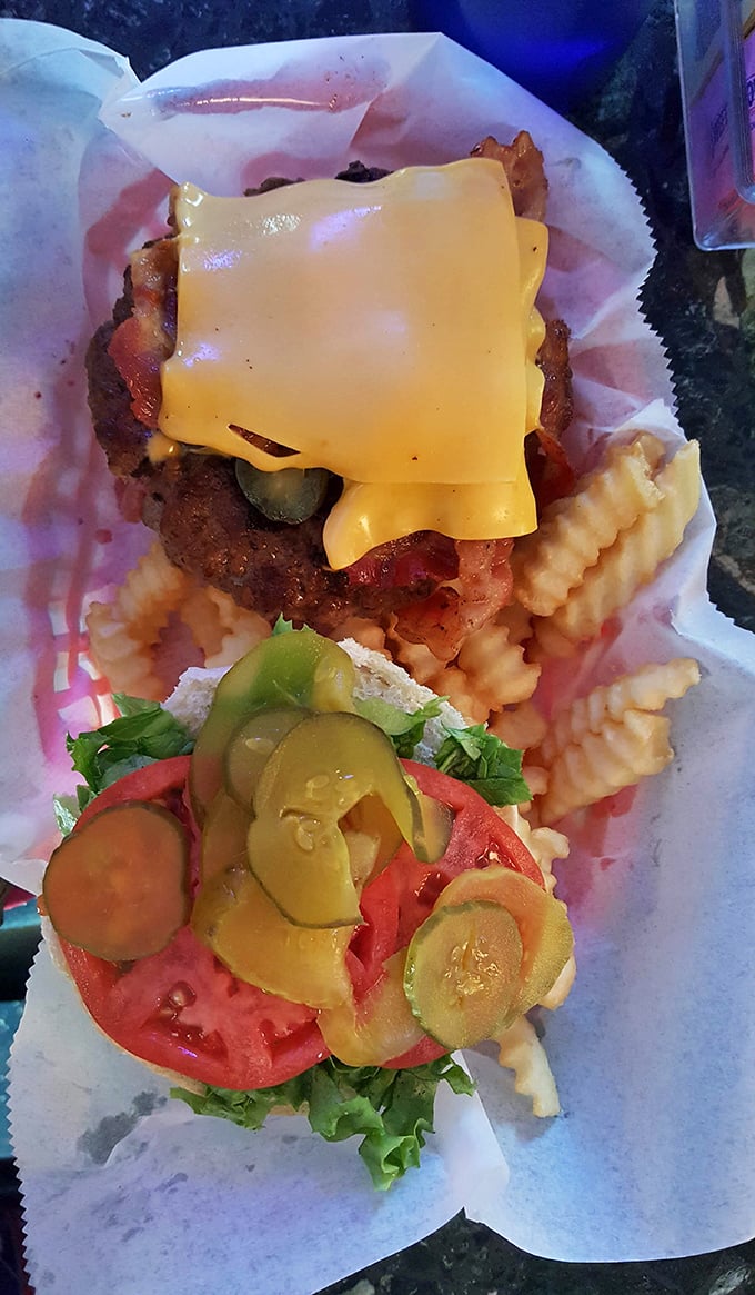 This isn't just a burger—it's architecture. Layers of beef, cheese, pickles, and fresh veggies create the skyscraper of satisfaction every appetite deserves.