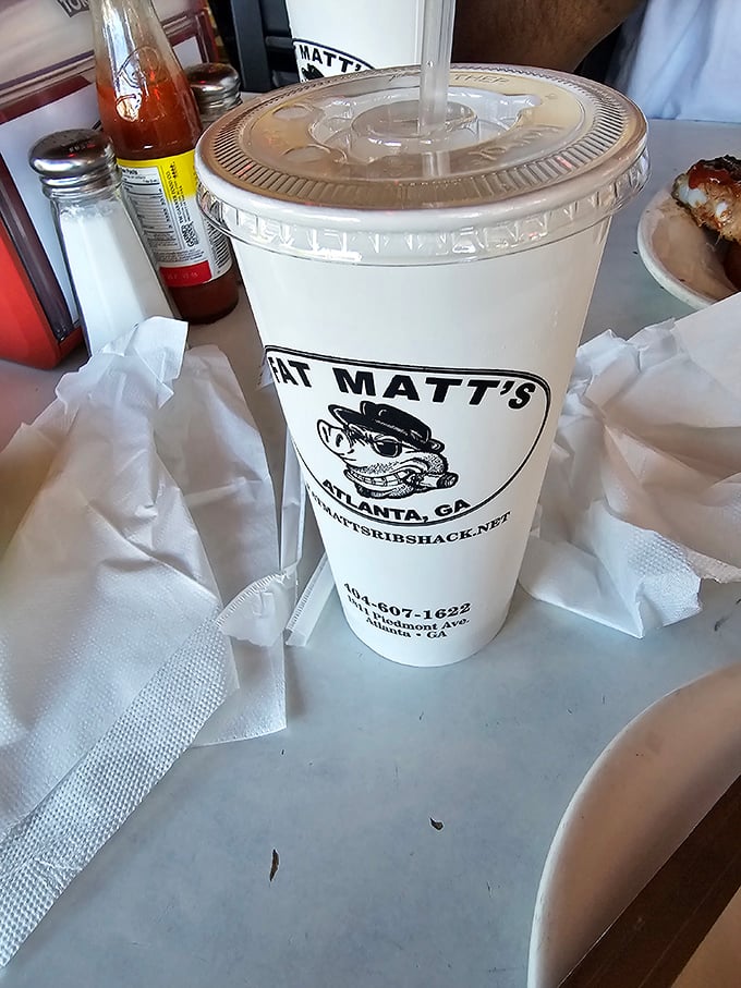 A Fat Matt's cup isn't just a vessel—it's a portable piece of Atlanta barbecue history, complete with their signature cartoon pig.
