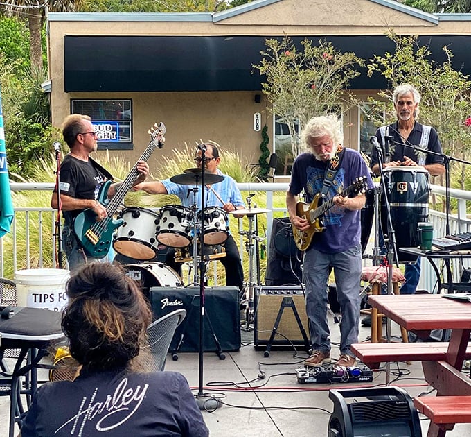 Nothing complements great food like live music on the patio. These guys aren't just playing tunes—they're providing the soundtrack to your food coma.