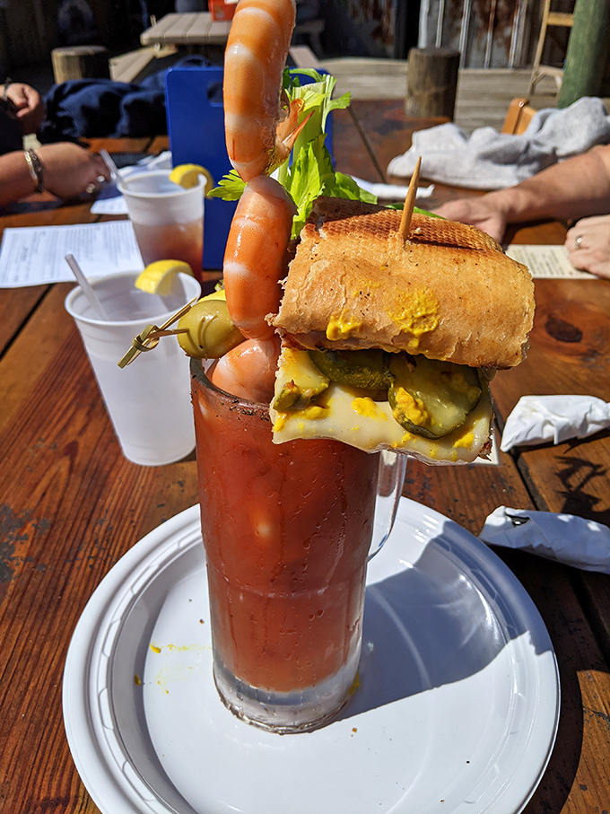 This isn't just a Bloody Mary—it's a full-on meal with a cocktail identity crisis, complete with sandwich and shrimp co-pilots.