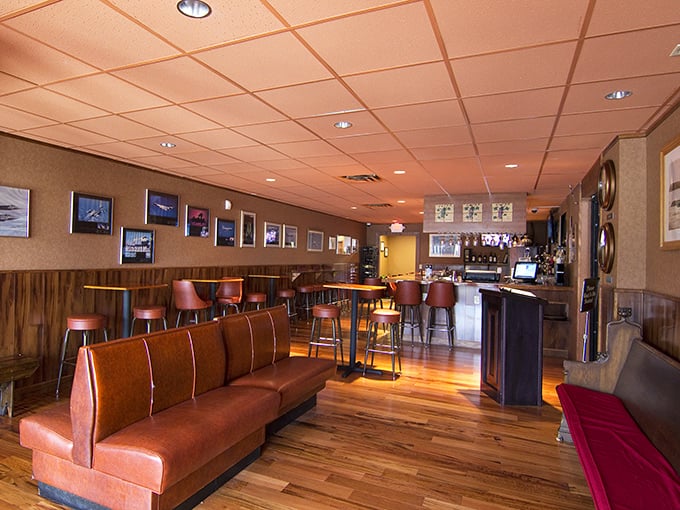 The lounge area whispers, "Stay awhile," with its warm wood tones and cozy booth seating – a sanctuary for carb enthusiasts.