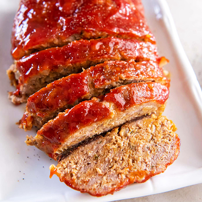 Grandma would approve of this meatloaf—glistening with tangy glaze and sliced thick enough to remind you that portion control is tomorrow's problem.
