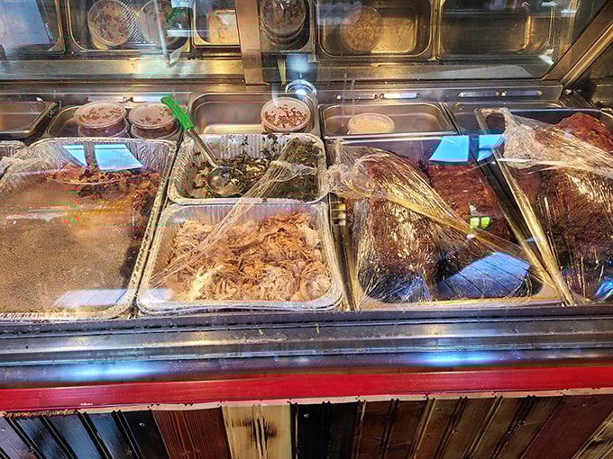 The meat display case—where barbecue dreams are born and difficult decisions must be made. Choose wisely, or just choose everything.