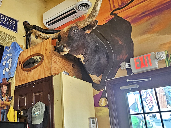 Not your average wall decor! This mounted longhorn keeps a watchful eye on diners, ensuring proper burger appreciation techniques.