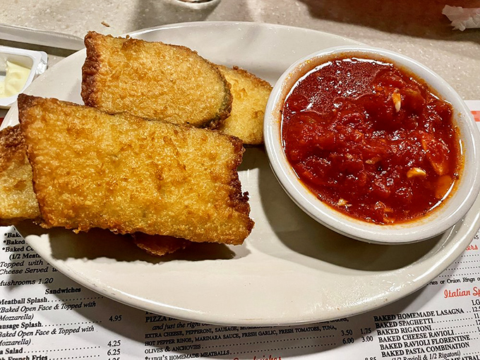 Garlic bread that's achieved the perfect golden ratio—crisp exterior, pillowy interior, and enough garlic to keep vampires at bay for a fortnight.