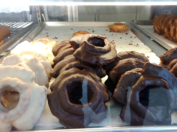 Chocolate-glazed old-fashioned donuts with their distinctive ridges—the corduroy pants of the donut world: classic, textured, and always satisfying.