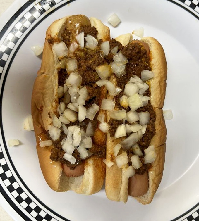 The original coney dog – where a humble hot dog meets meaty chili and diced onions in a marriage that's lasted longer than most Hollywood couples.