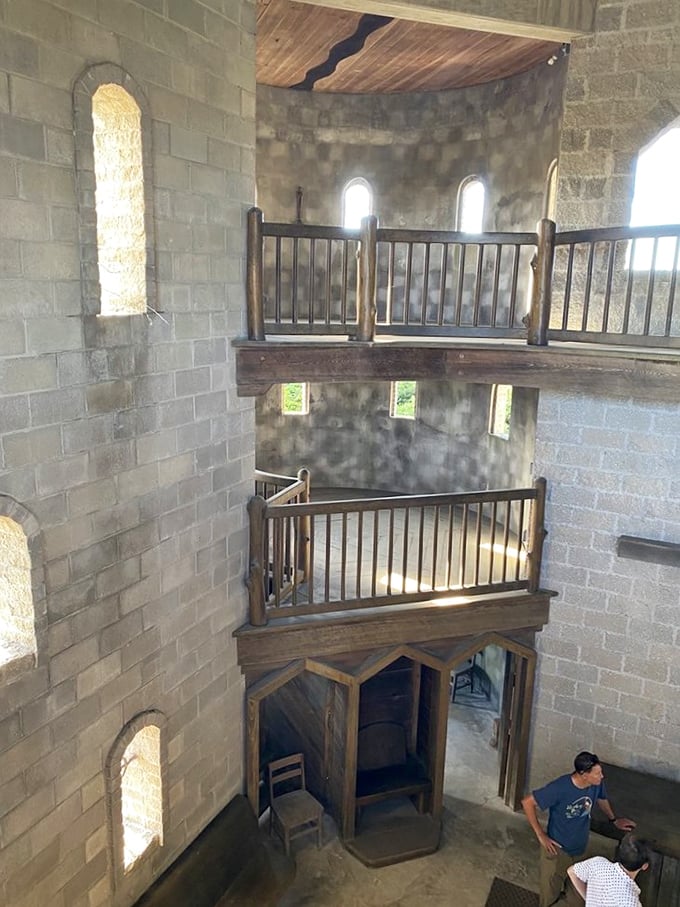 Multiple levels of wooden galleries create a cathedral-like interior space. The acoustics must be amazing—even a whisper would carry.