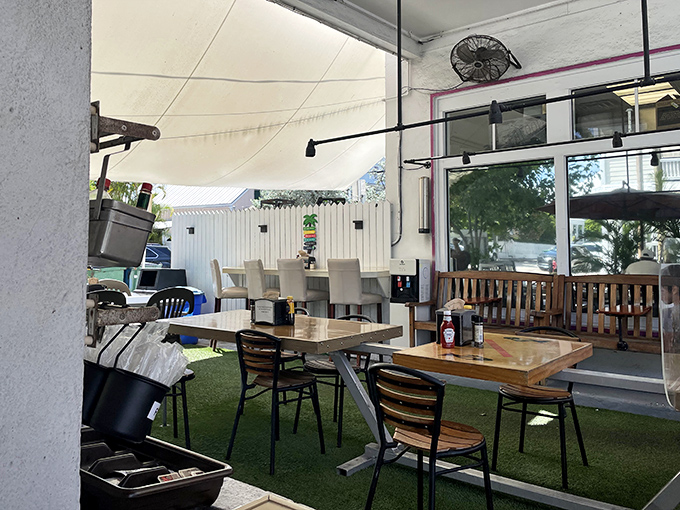 The outdoor seating area offers the quintessential Key West dining experience: casual tables, fresh air, and the anticipation of something delicious.