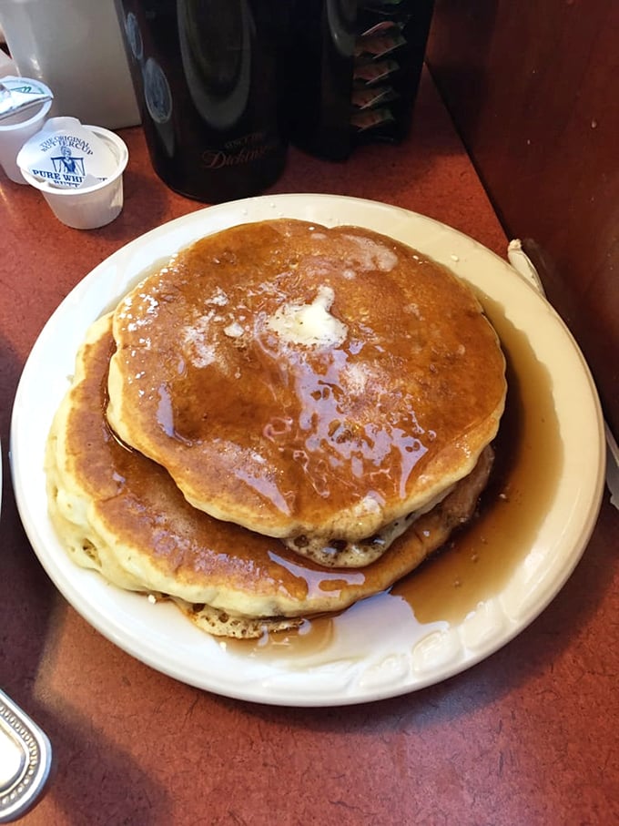 Golden-brown pancakes glistening with maple syrup—the breakfast equivalent of a warm hug on a plate.