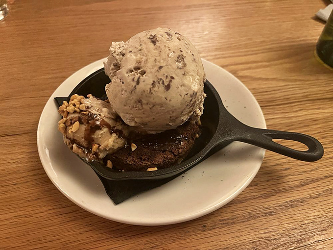 A brownie that makes you question every dessert decision you've ever made. That ice cream scoop is living its best life.
