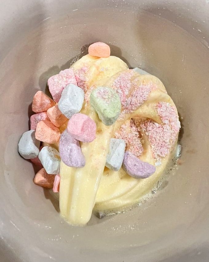 Soft-serve ice cream becomes an art form when adorned with colorful marshmallows – childhood nostalgia served in a grown-up portion.