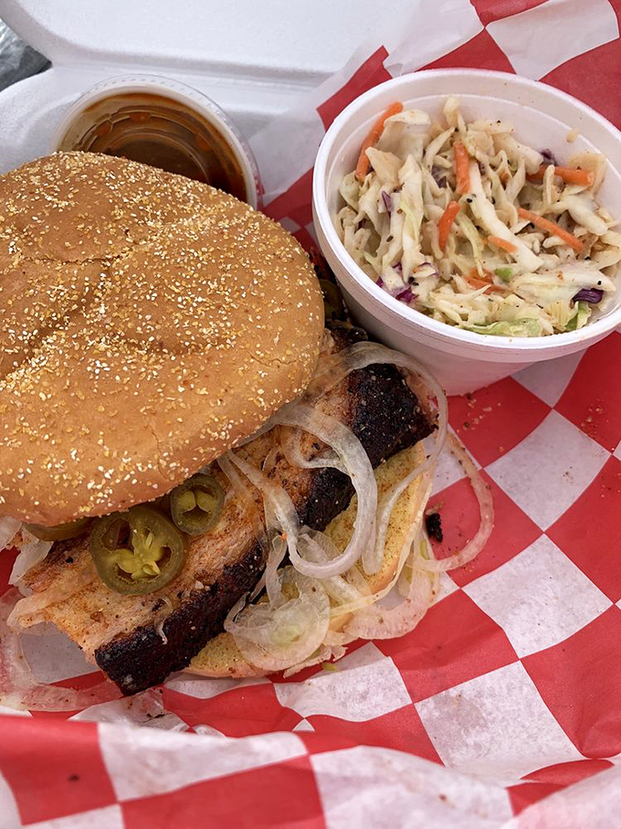 The coleslaw provides the perfect crisp counterpoint to this sandwich's main event—a glorious stack of meat with pickles and onions.
