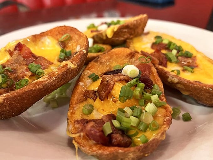 Potato skins loaded with cheese, bacon, and green onions—proof that sometimes the best part of the potato is what you can stuff into it.
