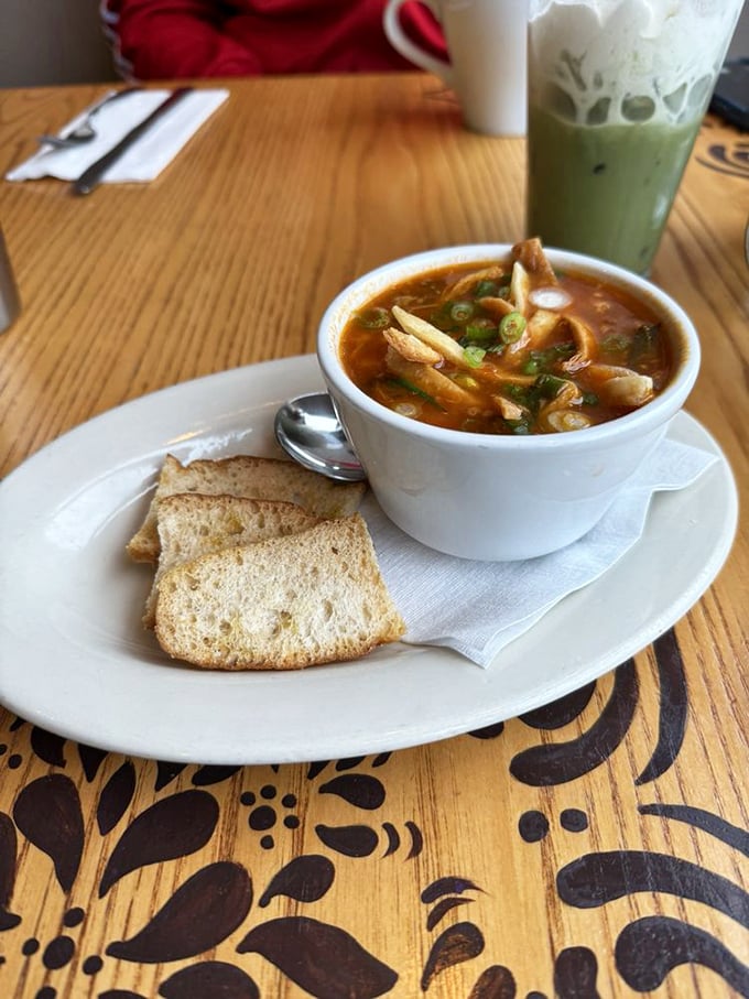 A soup that warms from the inside out. Tortilla strips float like life rafts in a sea of savory broth—comfort in a bowl.