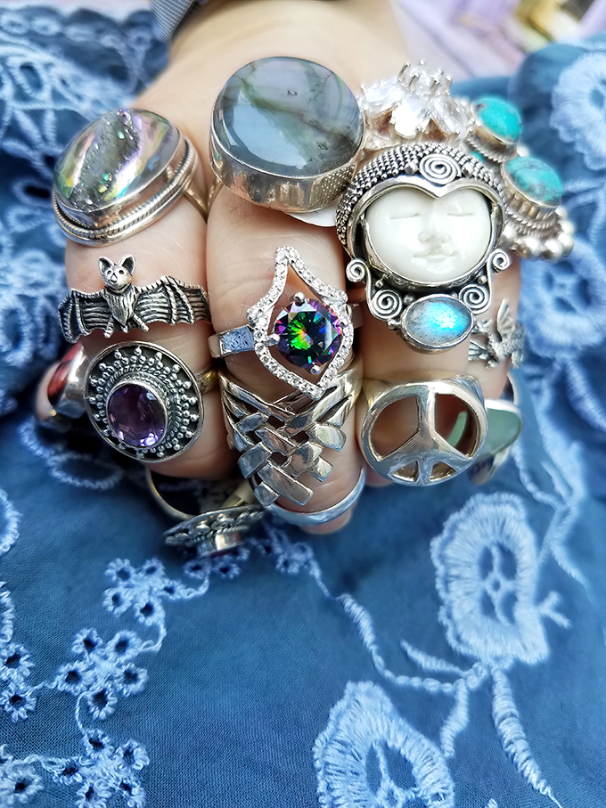Each ring tells a story—from mystical moon faces to peace symbols—all waiting for the right finger to continue their journey.