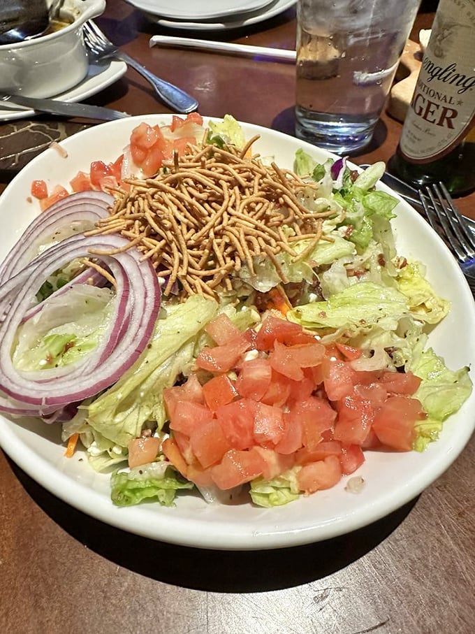 This salad with its fresh veggies and crispy toppings proves that sometimes, rabbit food can make even a committed carnivore pause between steak bites.