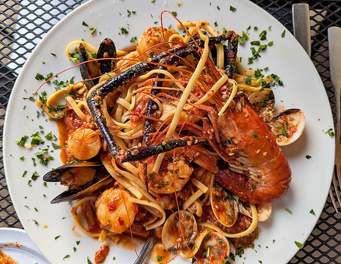 Seafood pasta that's having more fun than you are. Lobster, mussels, and shrimp throwing the party of the year on a bed of linguine.