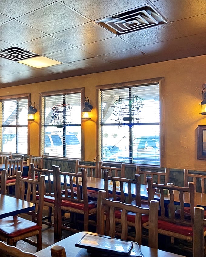 Rustic wooden chairs and warm lighting create that "come as you are" atmosphere that makes everyone feel like they've discovered a secret clubhouse.