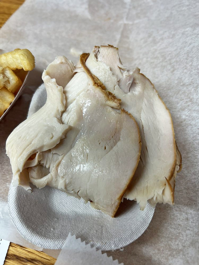 Smoked turkey sliced thin enough to read through but packed with enough flavor to write home about. Proof that pork isn't the only barbecue star.