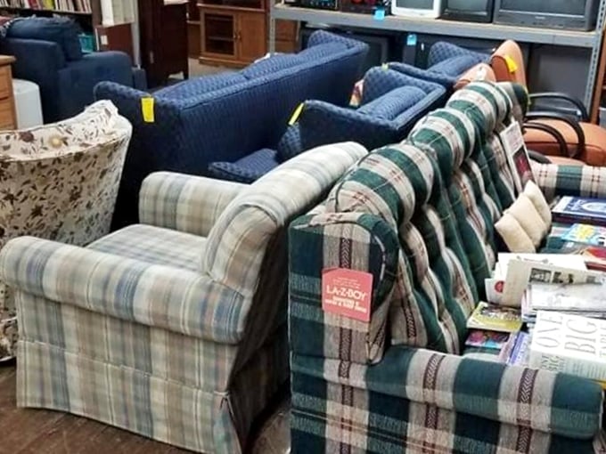The sofa section: where plaid patterns from three decades collide in a surprisingly charming testament to American living room history.