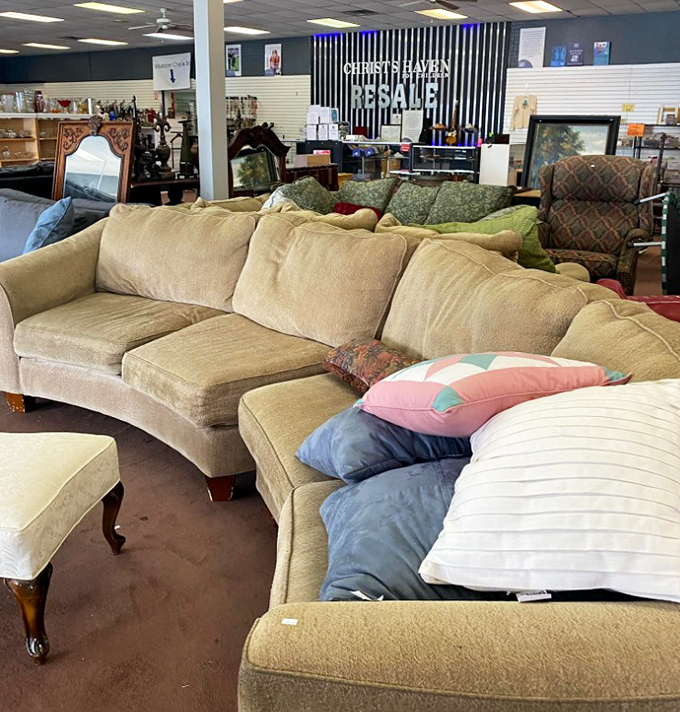 The curved sectional sofa—where family arguments and holiday naps have equal billing. Just add throw pillows and you're home.