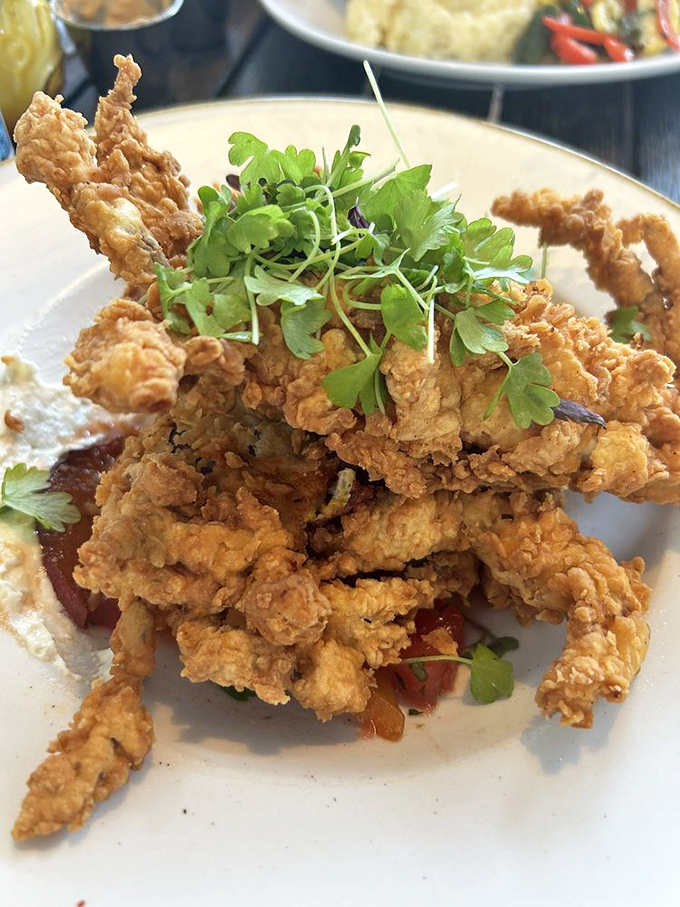 Soft shell crab that's been given the royal treatment—crispy, golden, and topped with microgreens that add both color and bragging rights.