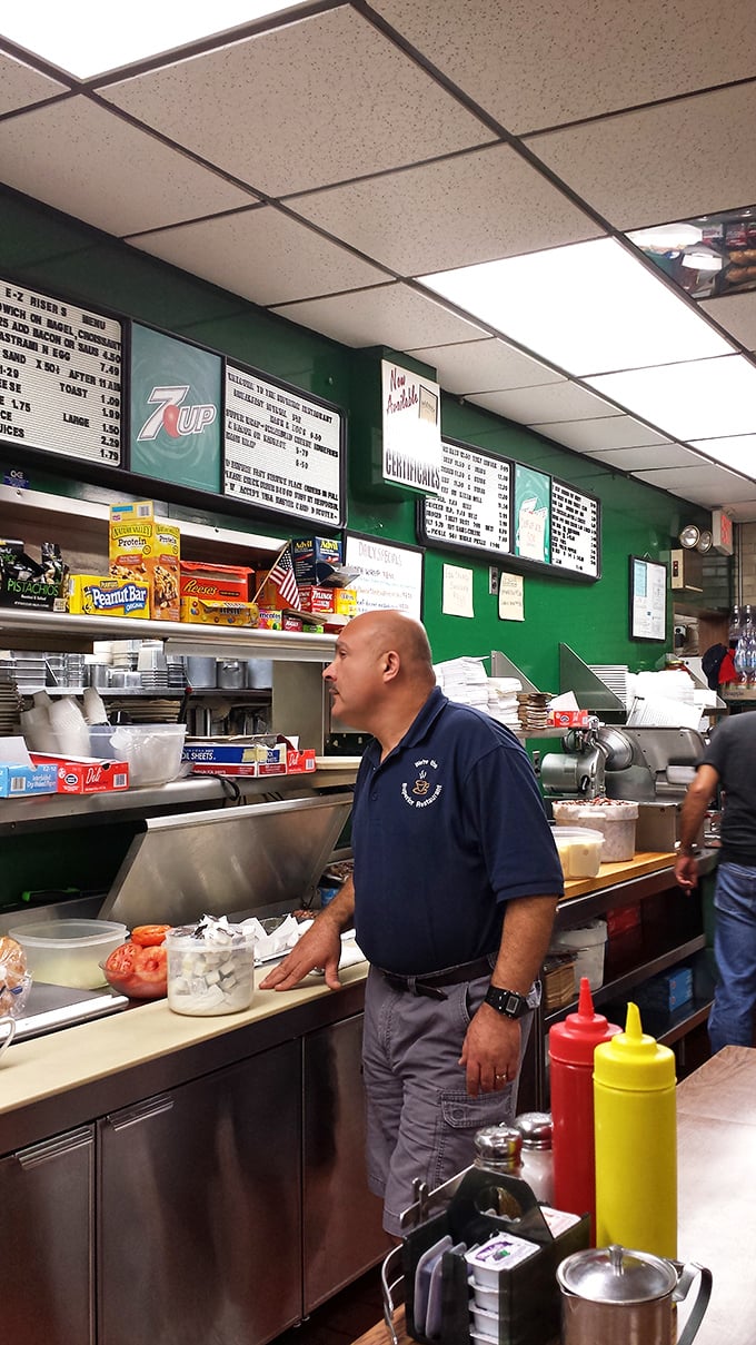 Behind every great sandwich is someone who knows exactly what they're doing. The kitchen choreography here has been perfected over decades.