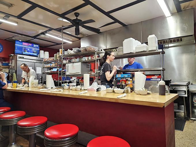 The culinary orchestra at work. When these folks are cooking, you're not just getting breakfast—you're getting decades of experience on a plate.