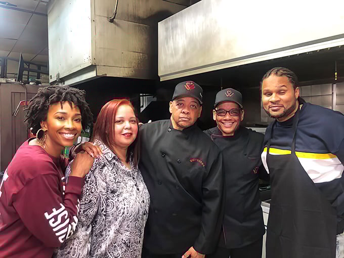 The smiling kitchen crew behind the magic, proving that great food comes from people who genuinely love cooking.