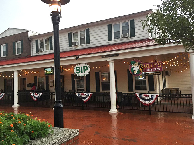 Sully's Irish Pub's festive front porch practically shouts "come in for a pint!" Those string lights aren't just decoration—they're an invitation.